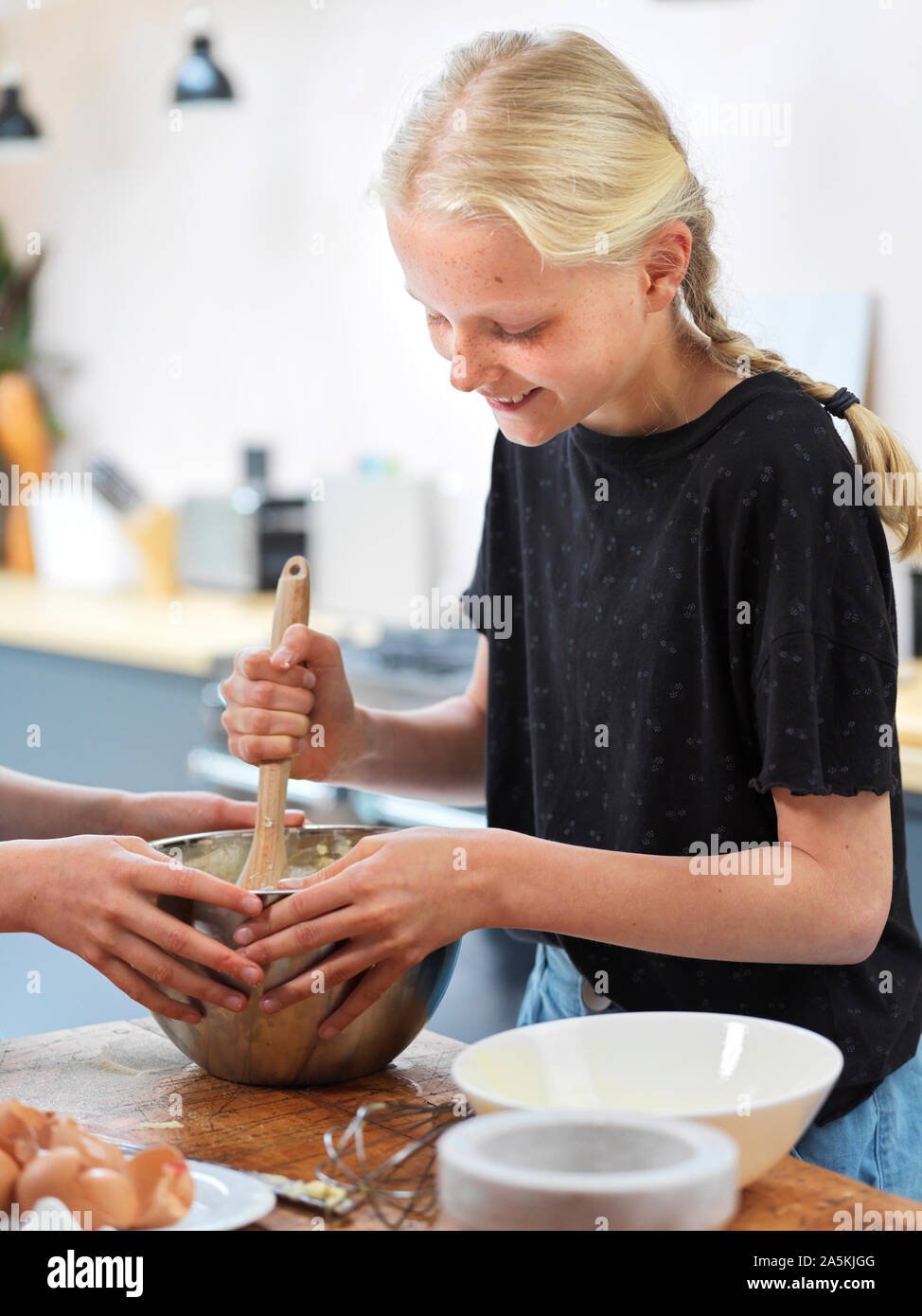 Child stirring wooden spoon hi-res stock photography and images - Alamy
