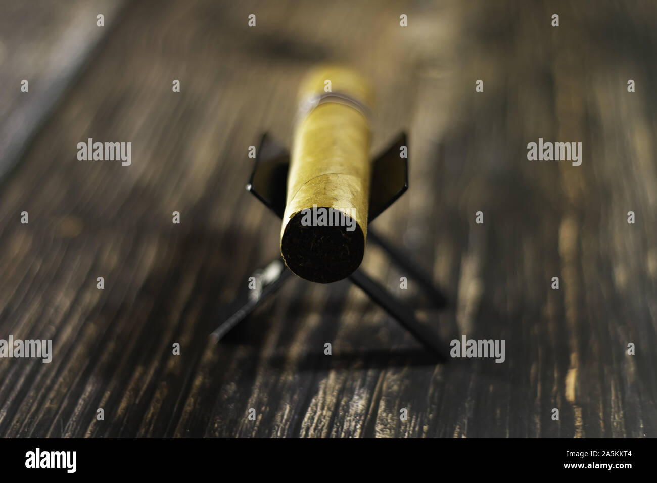 Cigar with the holder on the wood table Stock Photo - Alamy