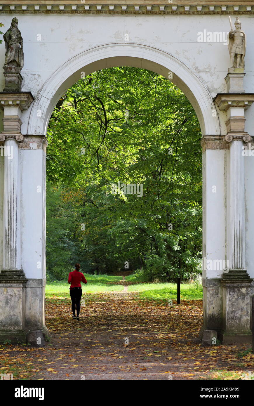 Autumn in the Polish Park, gate in the park, park with a historic arch ...
