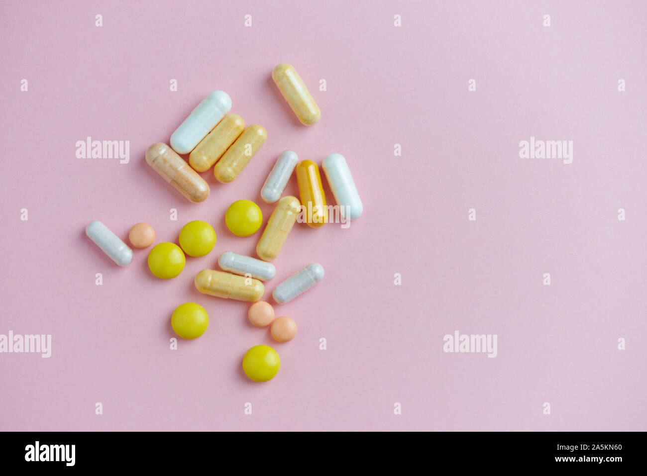 Vitamins and supplements on bright paper background. Concept for a ...