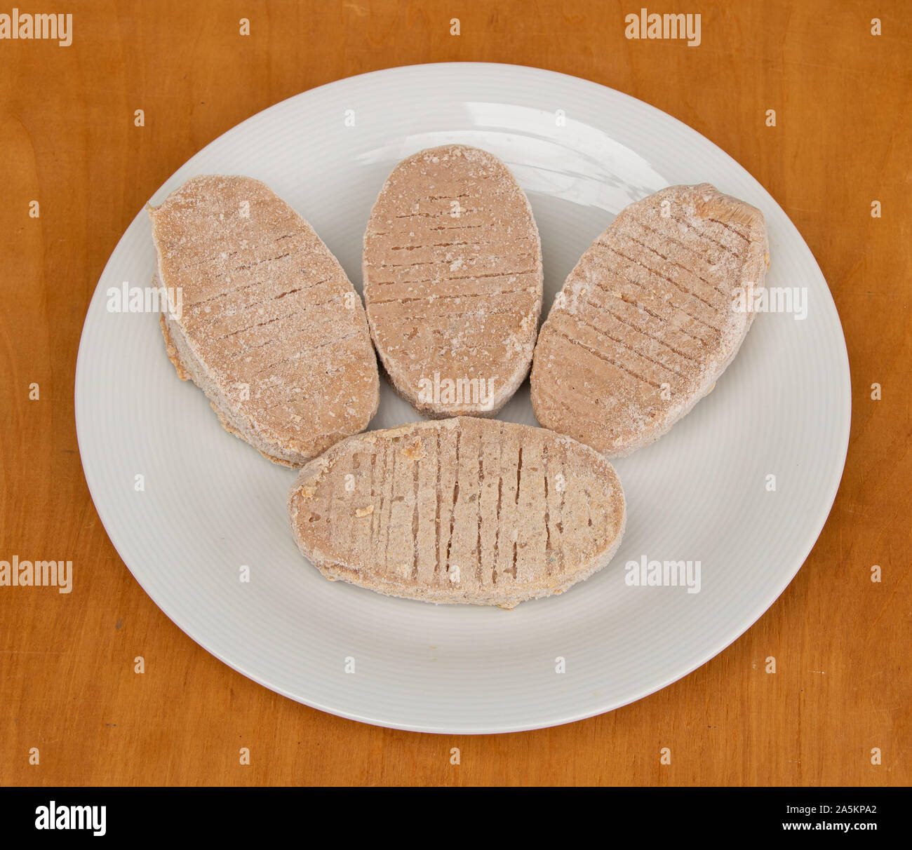 Cutlet on a plate in the cooking process Stock Photo - Alamy