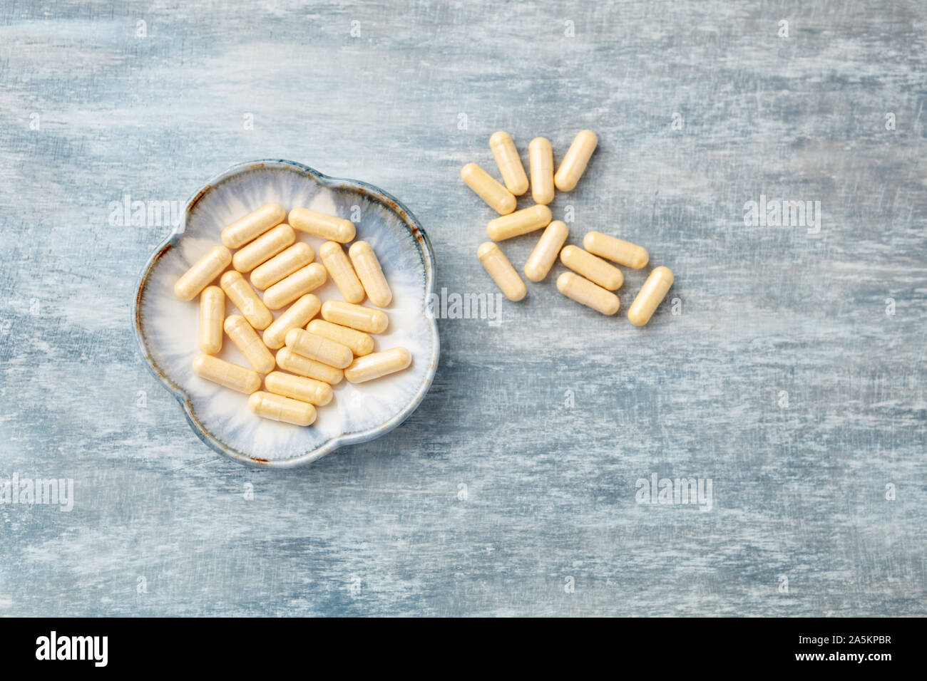 Coenzyme Q10 capsules. Dietary supplements. Rustic wooden background ...