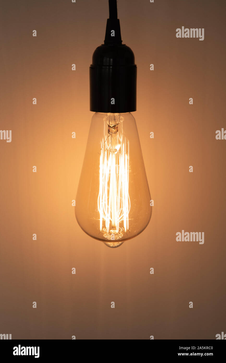 Vintage Edison lightbulb on black cord Stock Photo - Alamy