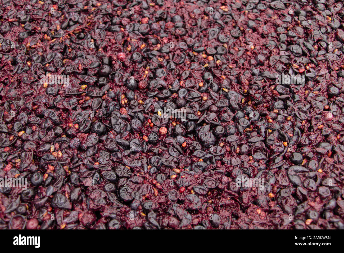 Red wine fermentation in process texture background Stock Photo - Alamy
