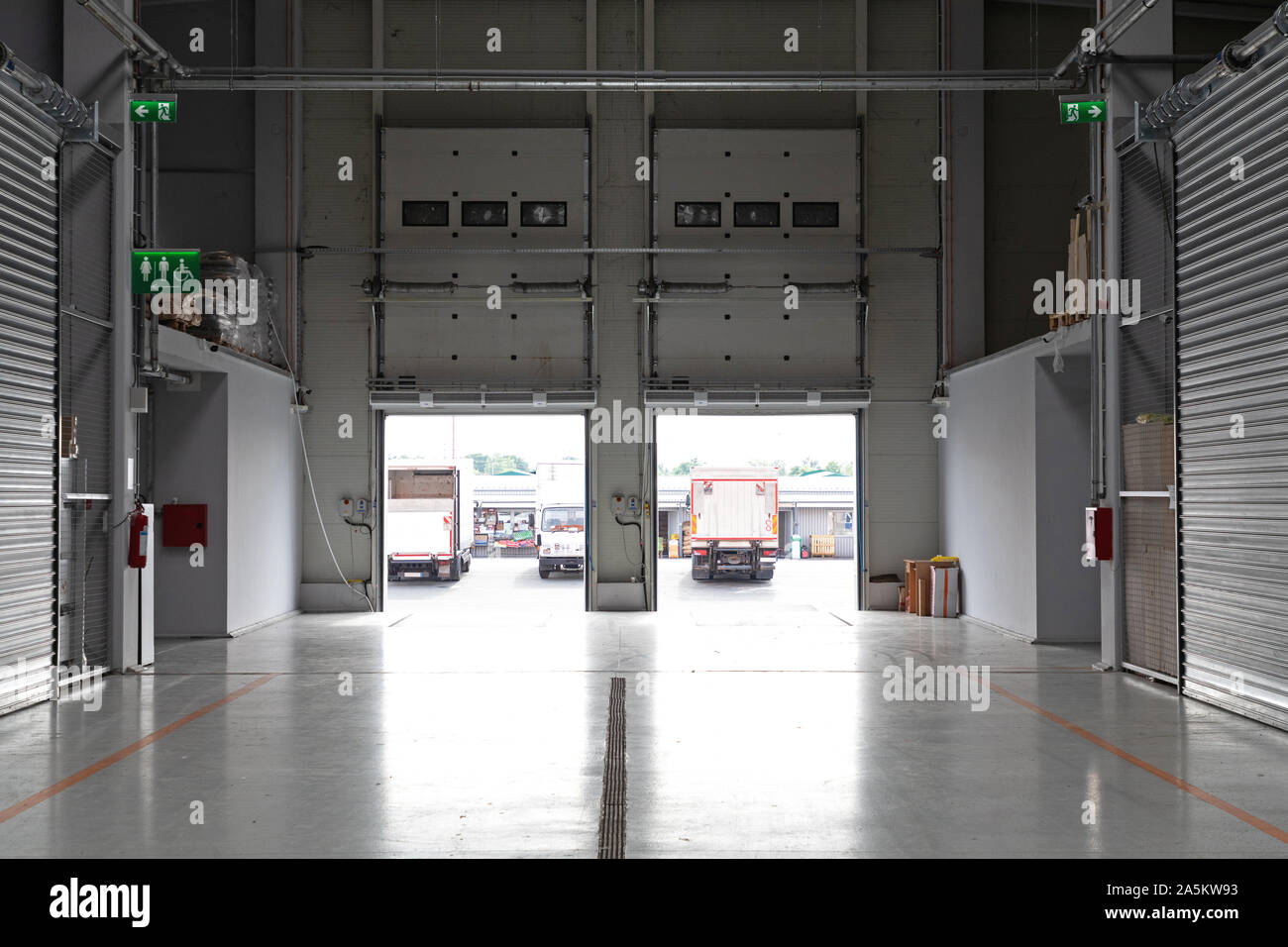 Distribution Warehouse Interior With Two Cargo Doors Stock Photo - Alamy