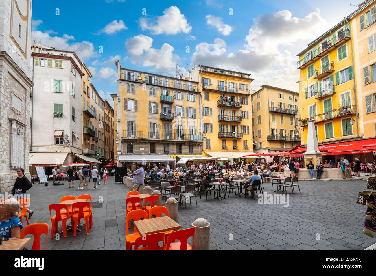 Tourists enjoy a late afternoon at the shops and cafes at Place ...