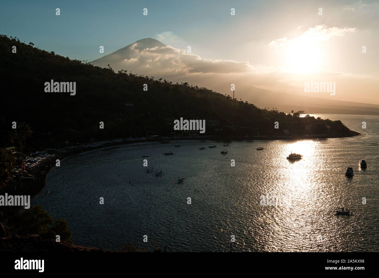 Sunset behind impressive vulcano, bright sunlight Stock Photo - Alamy
