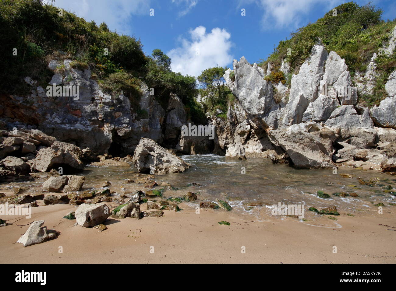 Paradisiacal beach of Gulpiyuri in Llanes (Asturias, Spain Stock Photo ...