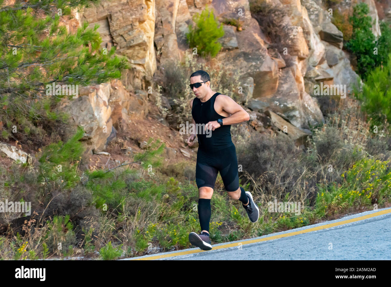 Fast athlete running in forest hi-res stock photography and images - Alamy