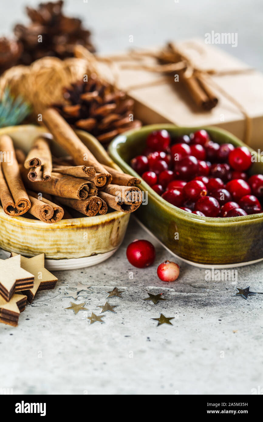Christmas background with christmas tree, cones, cinnamon and ...