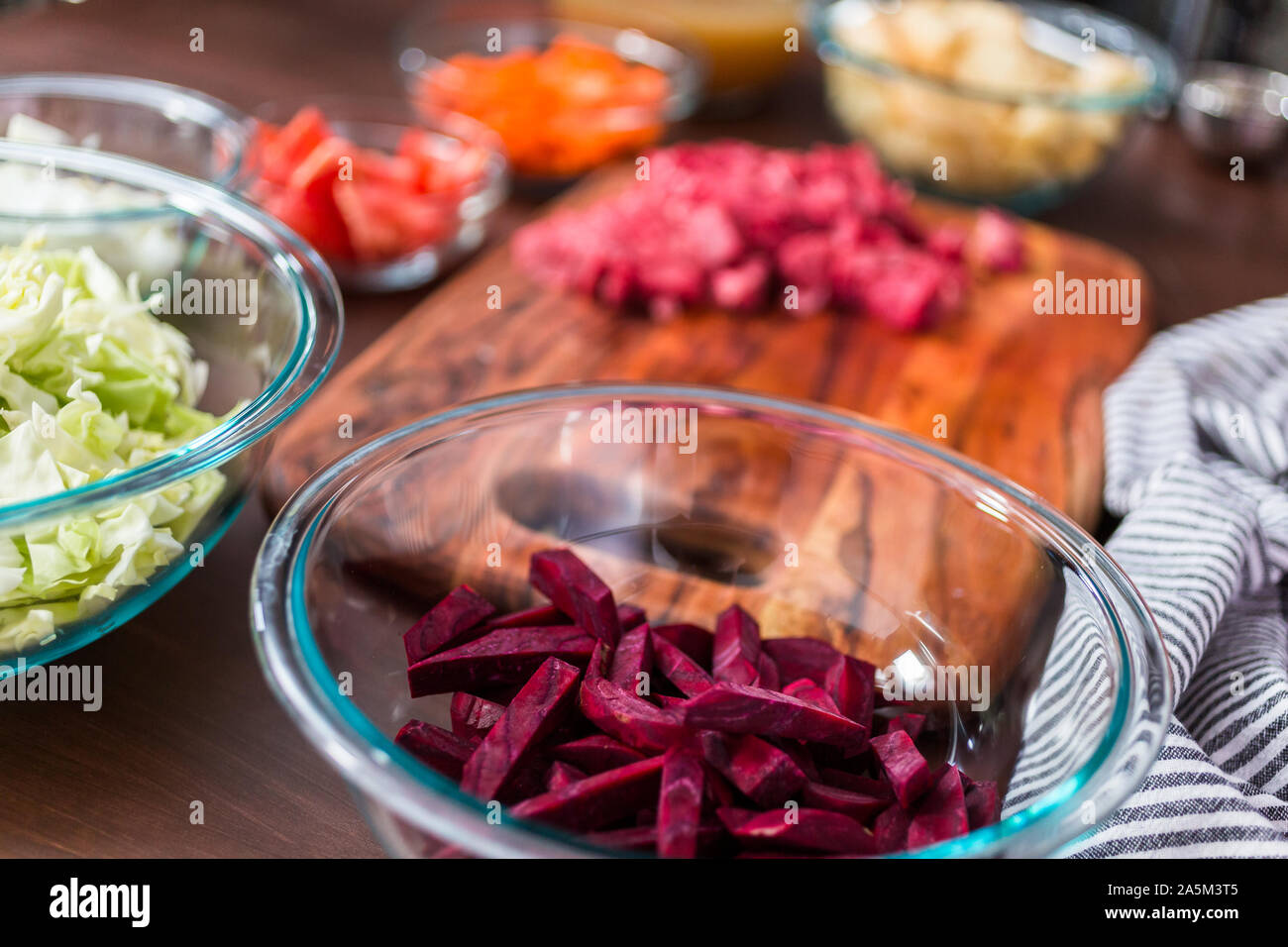 Sliced organic beets in a glass bowl to make borscht Stock Photo - Alamy