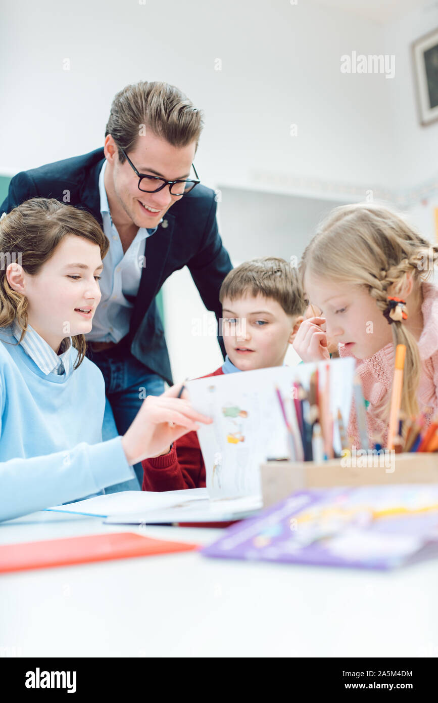 Happy students group work classroom hi-res stock photography and images ...