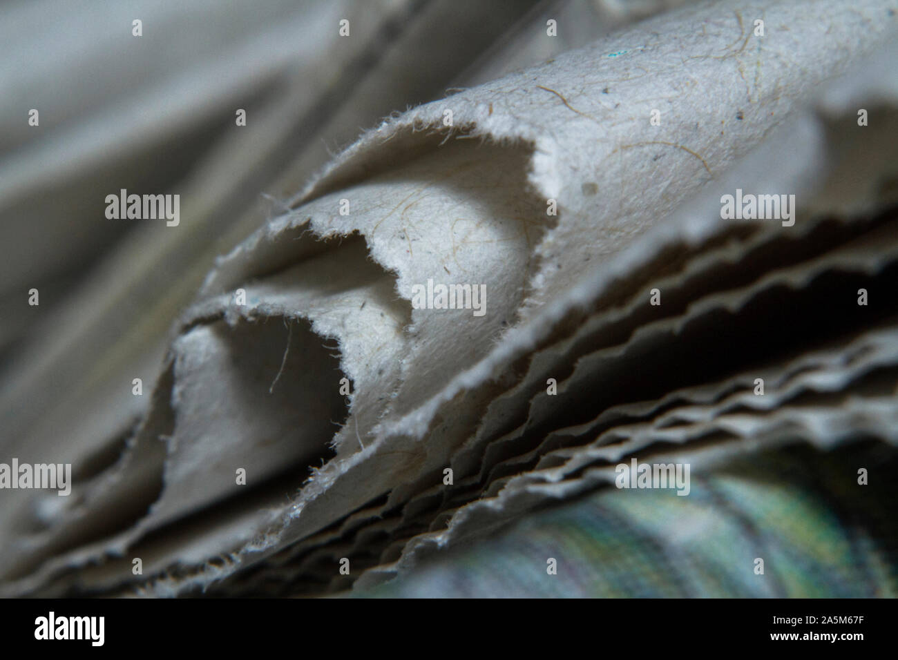 Macro shots folded a newspaper closeup picture Stock Photo - Alamy