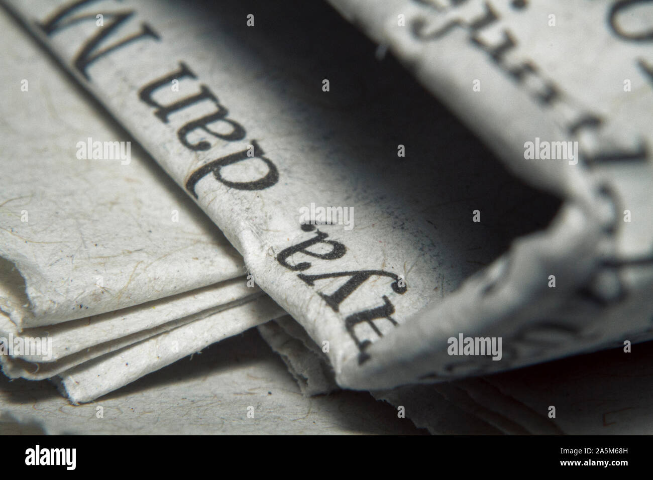 Macro shots folded a newspaper closeup picture Stock Photo - Alamy