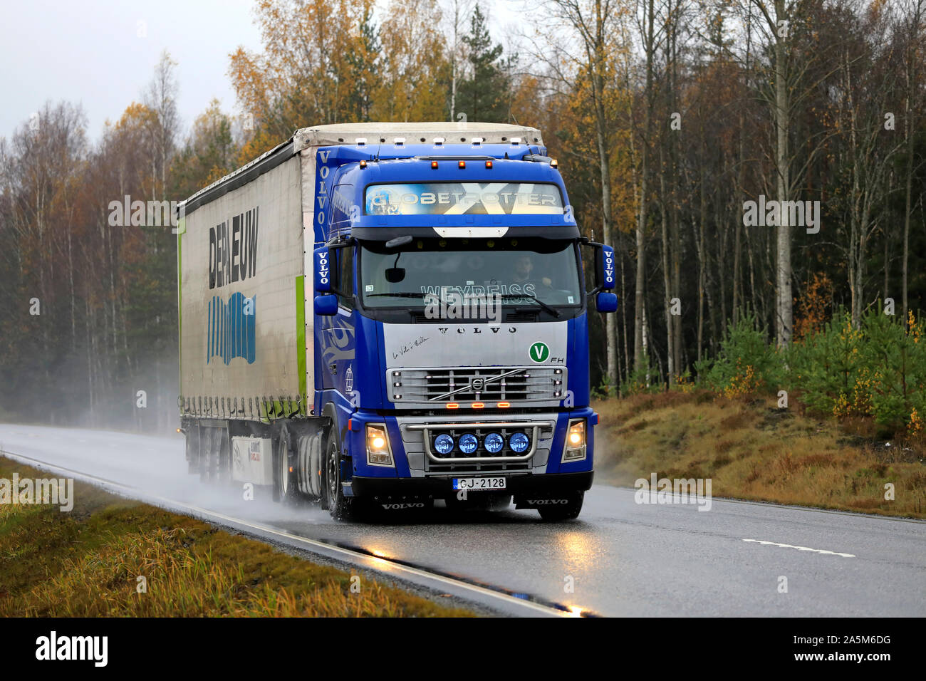 Blue, customised Volvo FH freight truck Weyreiss hauls goods along ...