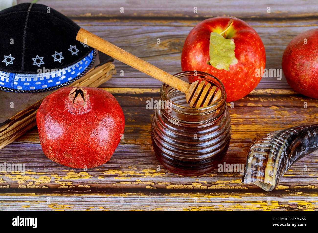 Honey on the pomegranate and apples. Jewish new year Rosh Ha Shana ...