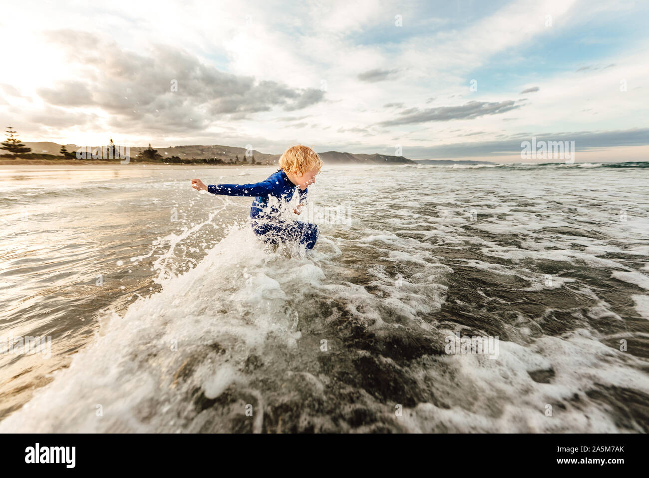 Kids jumping waves hi-res stock photography and images - Alamy