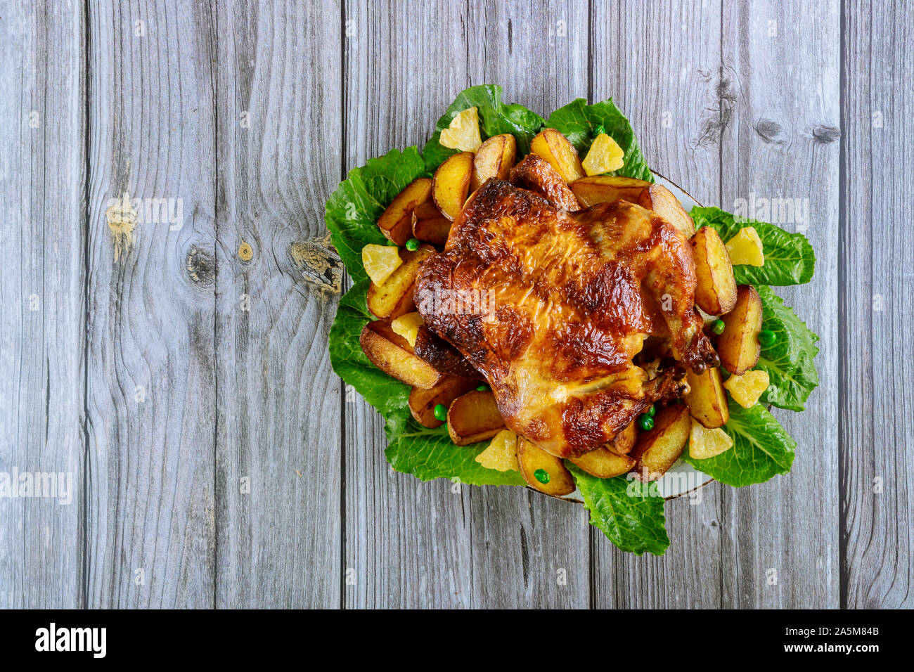 Thanksgiving day dinner table setting with whole roasted chicken Stock ...