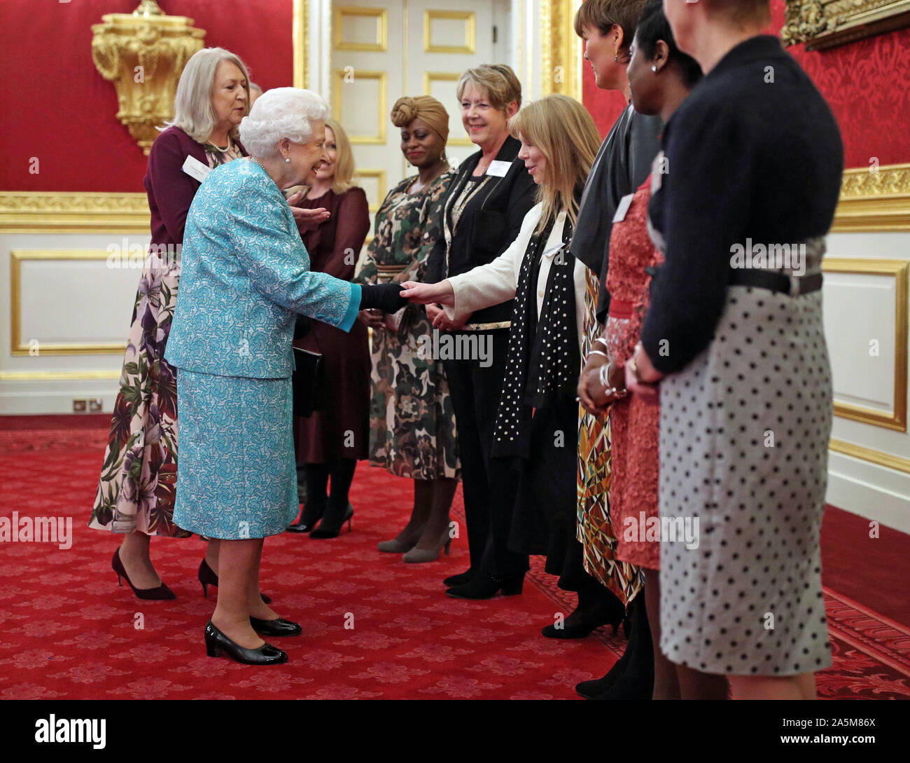 Queen Elizabeth II meeting volunteers, including Julie Ellison from ...