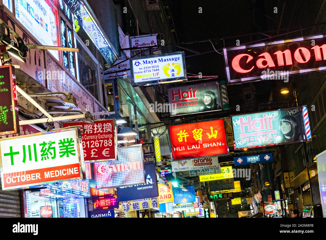 Lighted signs advertising businesses on Lock Road in Tsim Sha Tsui ...