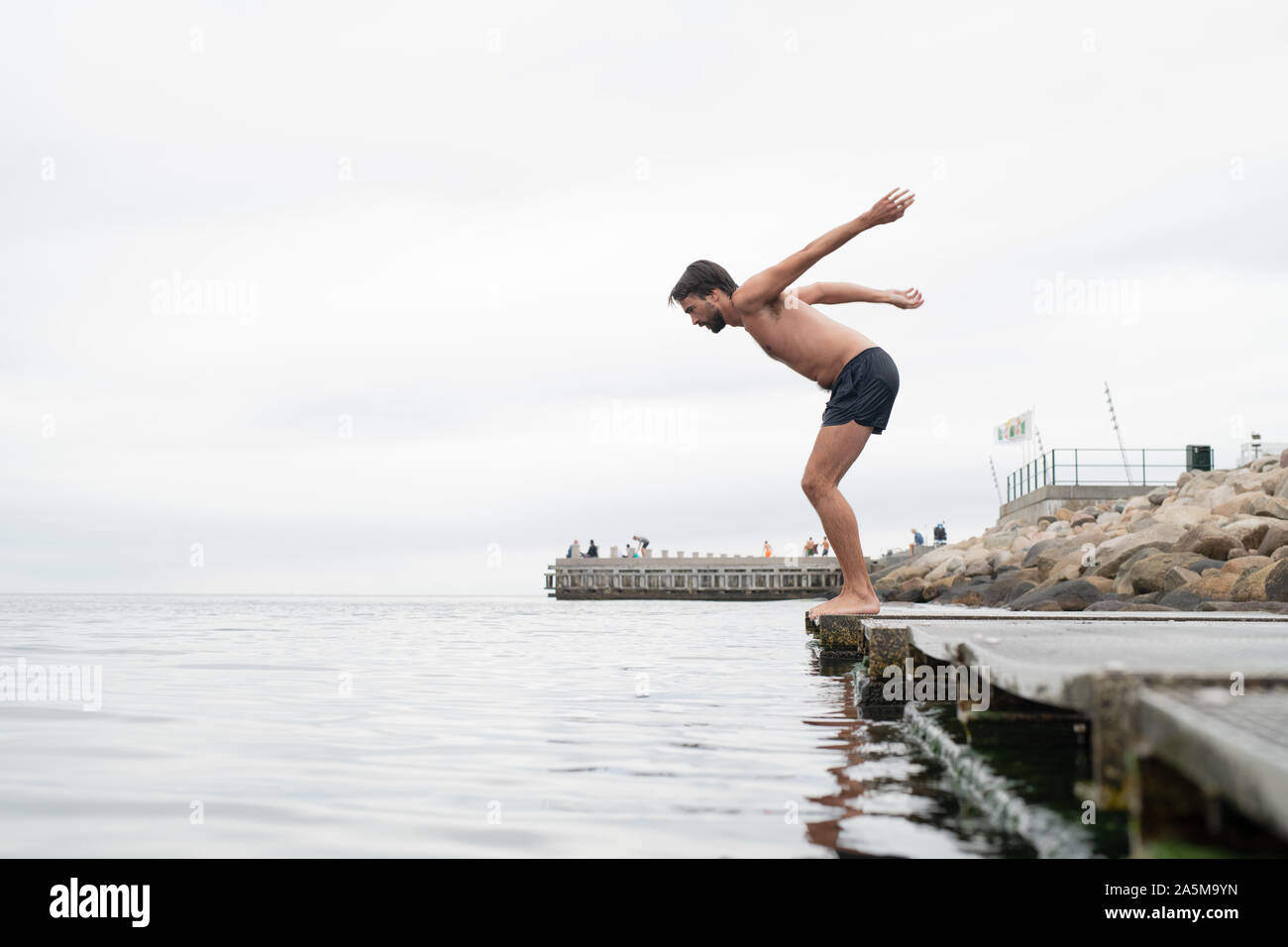 Man diving into sea hi-res stock photography and images - Alamy