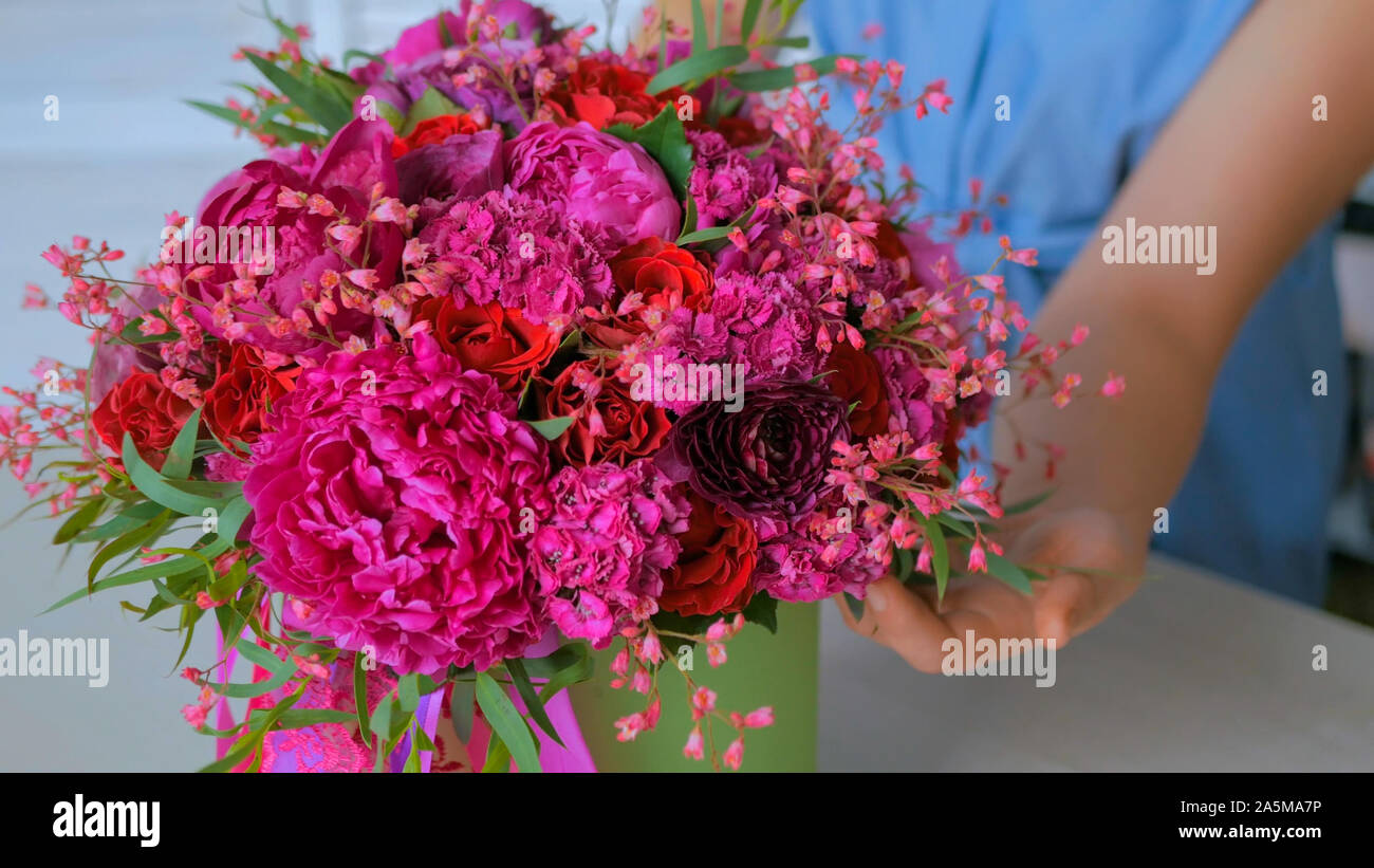 Professional florist showing bouquet studio hi-res stock photography ...