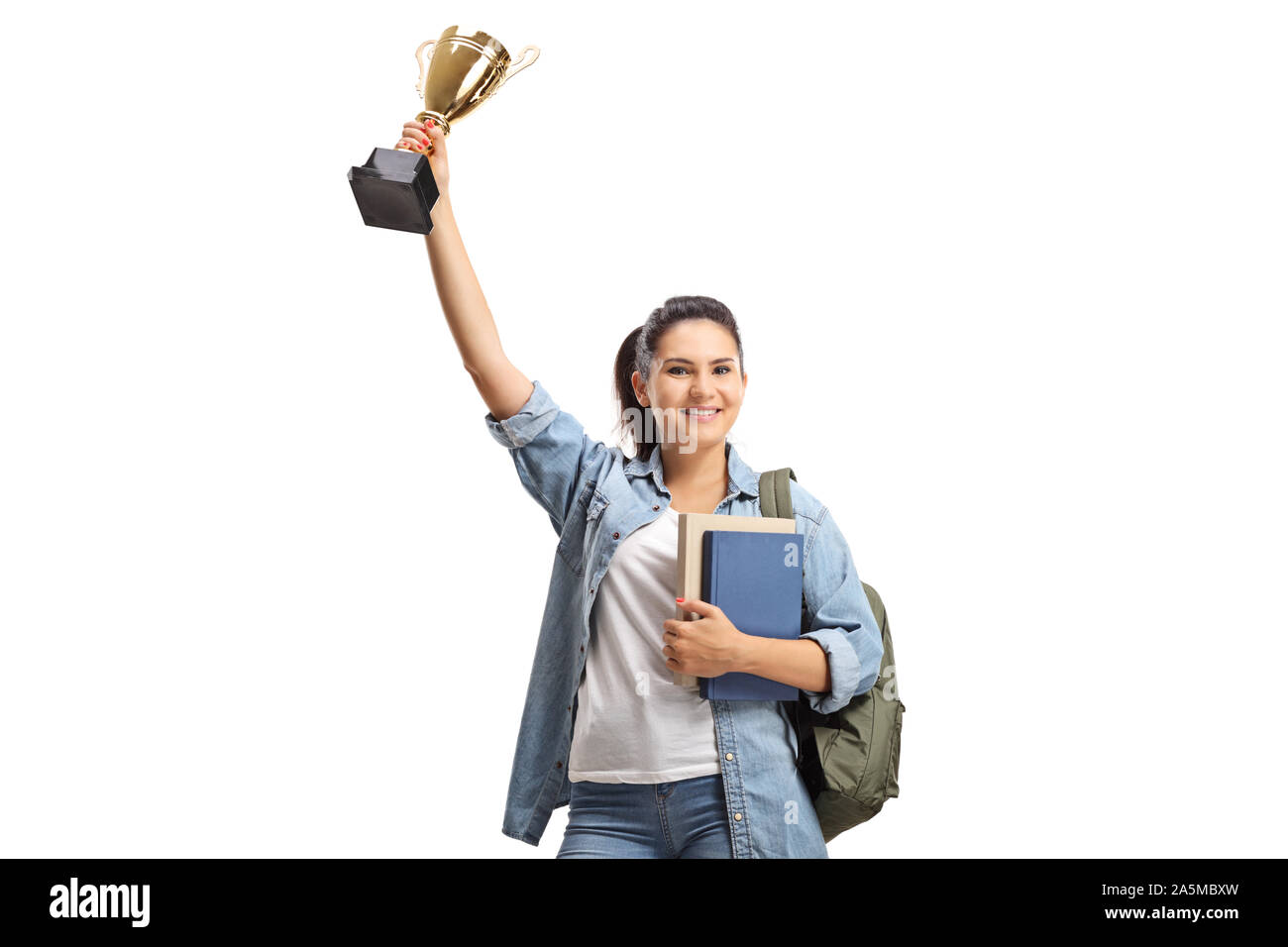 Happy female student holding a gold trophy isolated on white background ...