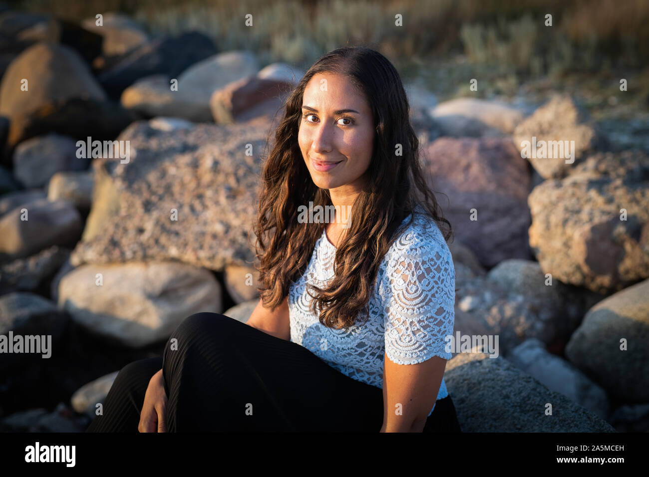 Woman watching sunset over ocean hi-res stock photography and images ...