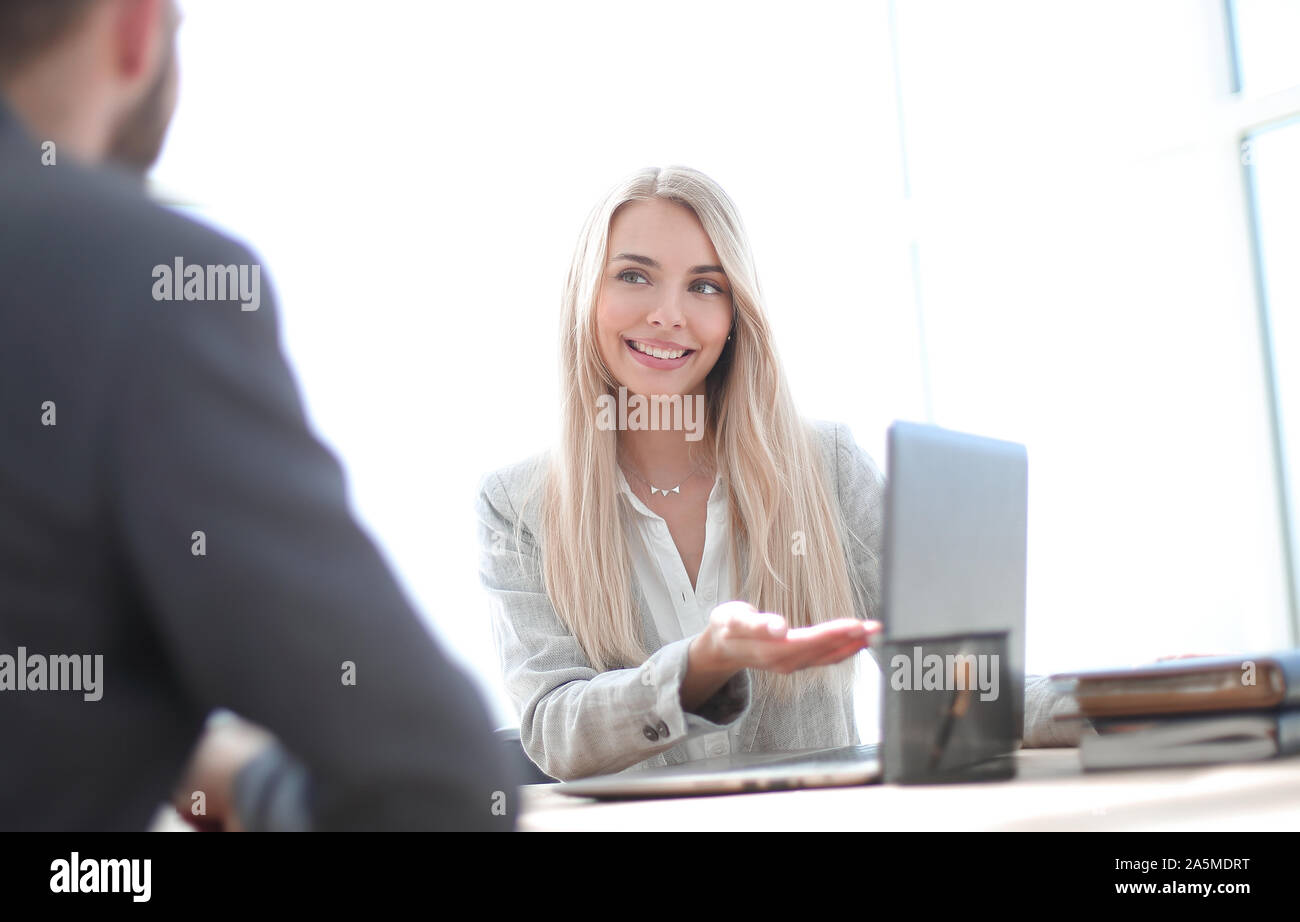smiling businesswoman explaining something to her colleague Stock Photo ...