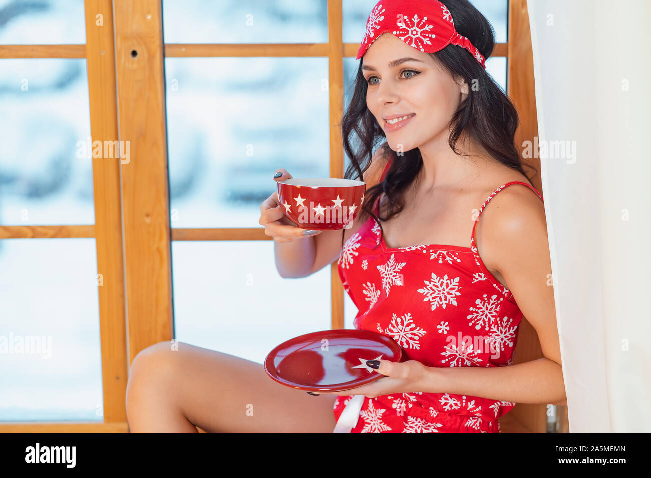 Beautiful Young Brunette Woman Wearing Red Pajamas Sitting Home By The