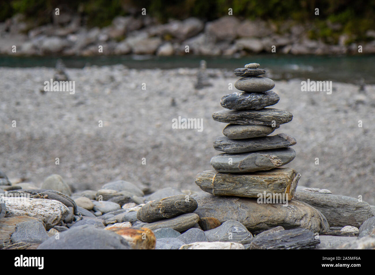 stone pyramids near fantail falls, Wanaka, New Zealand Stock Photo - Alamy