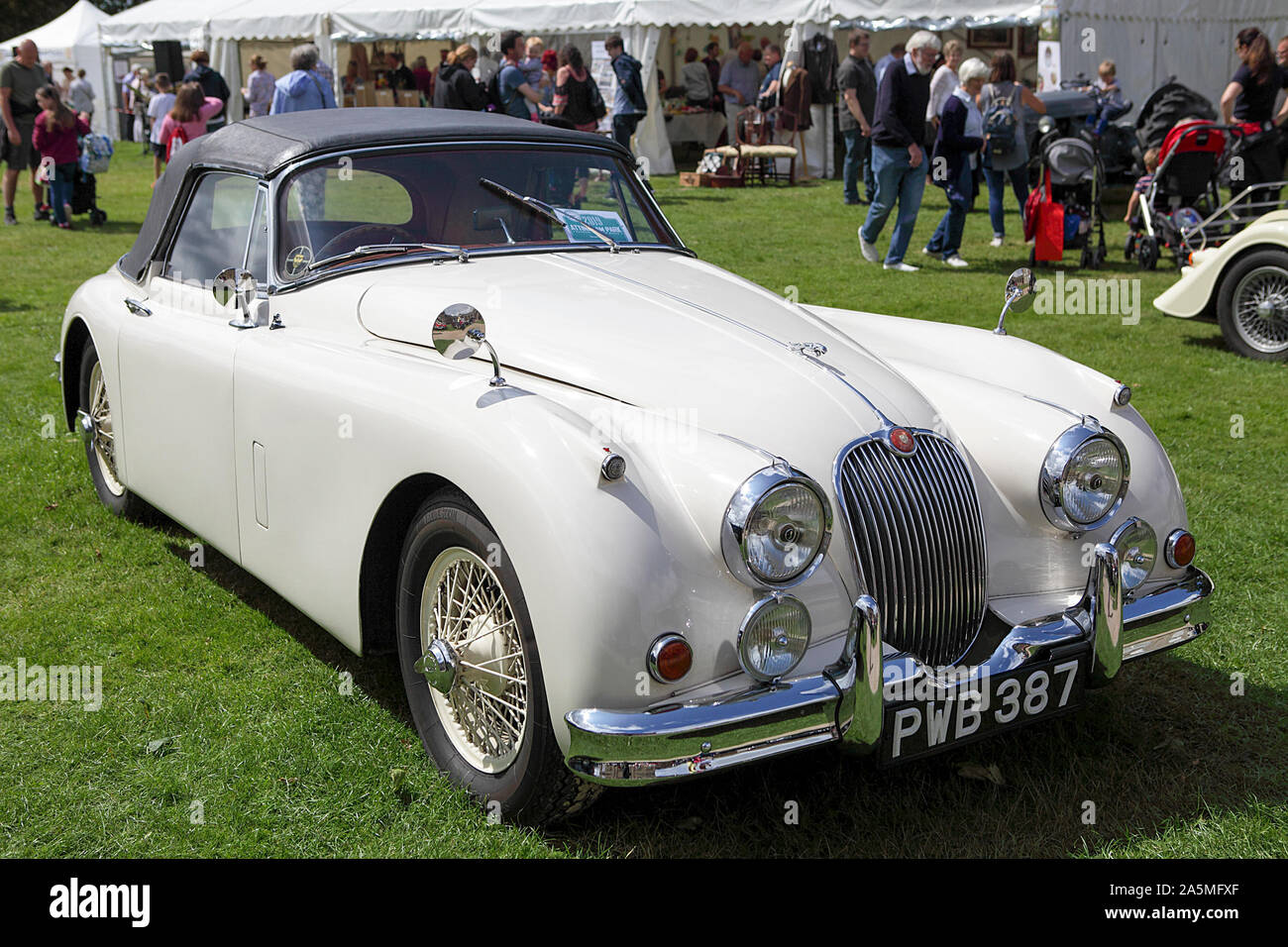Viewed here is a superb Jaguar XK150 convertible exhibited at a vintage ...