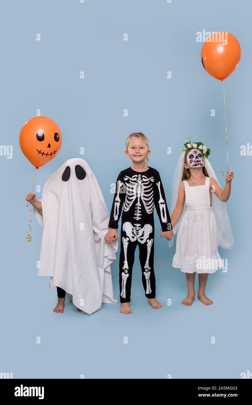 Kids in costumes ghost, skeleton and dead bride ready for halloween ...