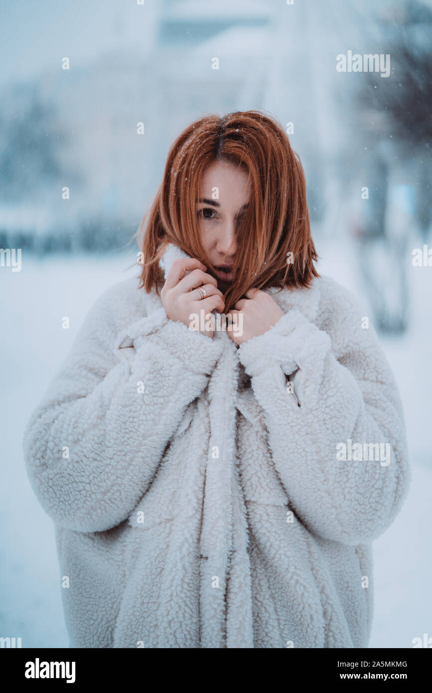 Portrait female model outside in first snow Stock Photo - Alamy