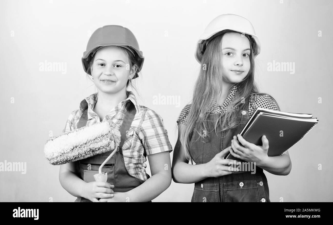 school project. small girls repairing together in workshop. Labor day ...