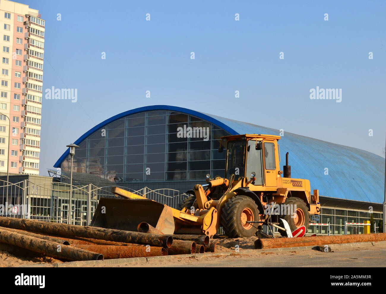 Front-end loader working on construction site during the renovation of ...