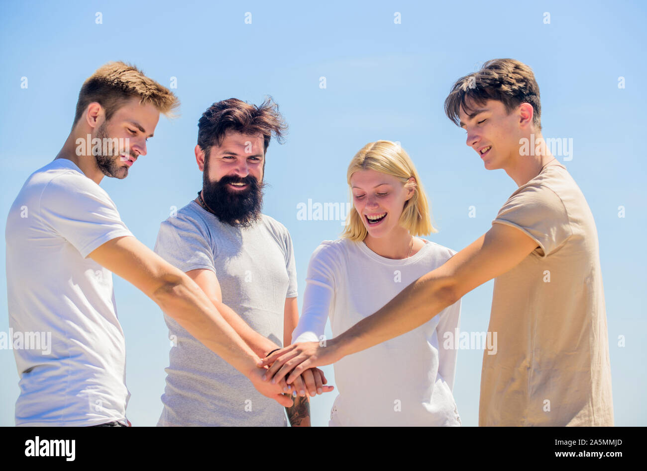 Business team. Community member. cheerful guys and girl. group of four ...