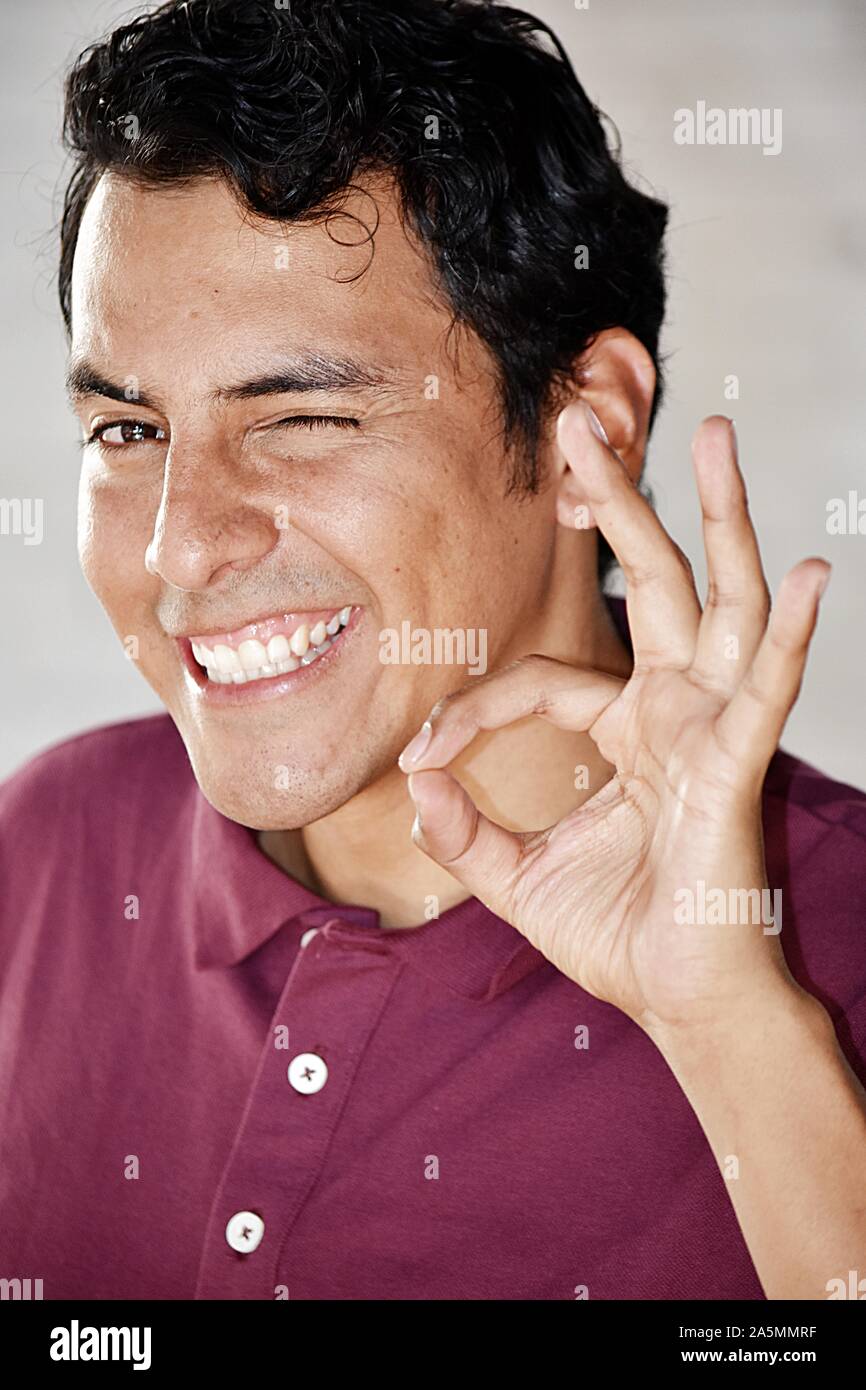 Hispanic Male And Okay Sign Stock Photo - Alamy