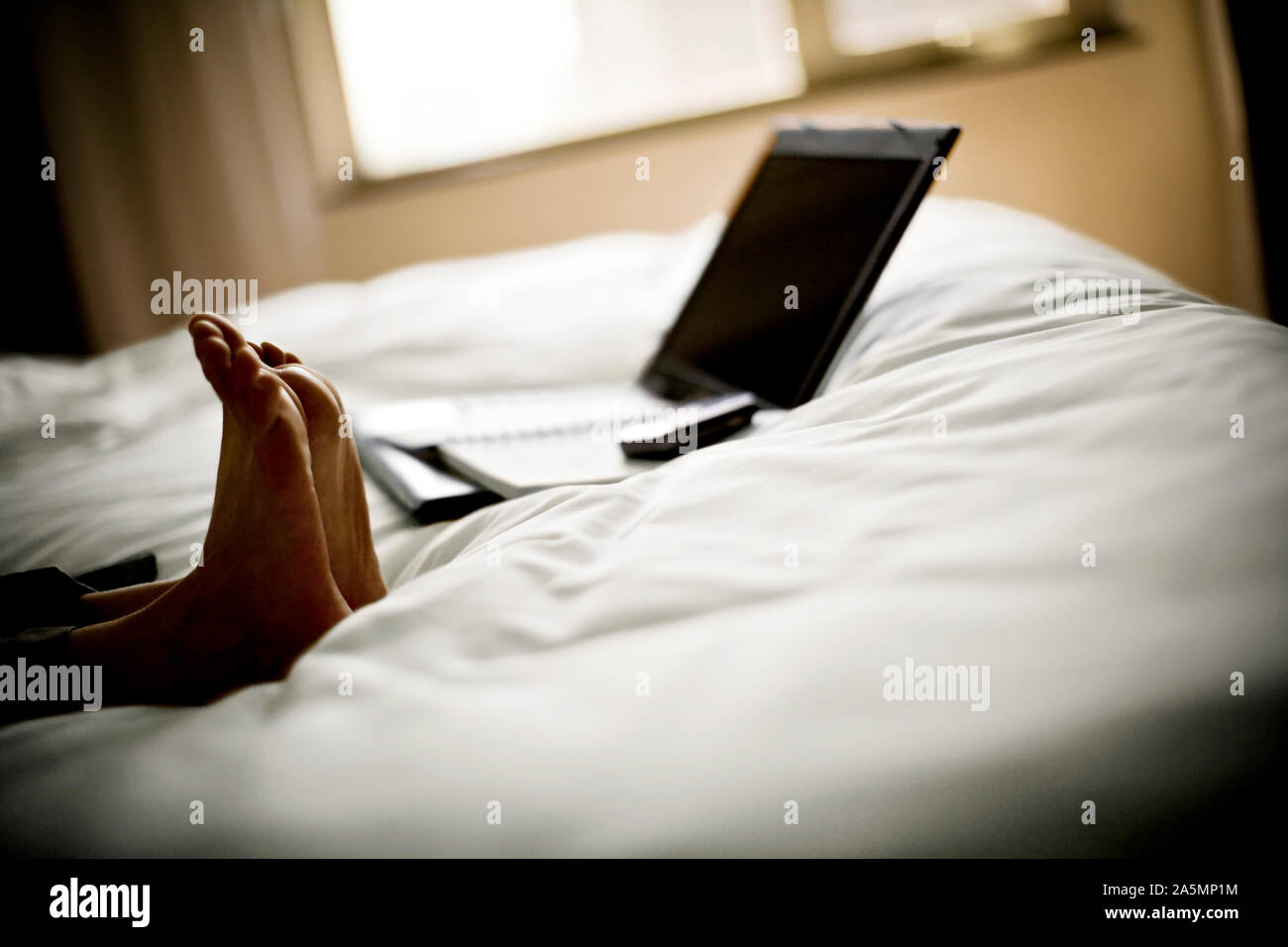 Womans feet on bed hi-res stock photography and images - Alamy