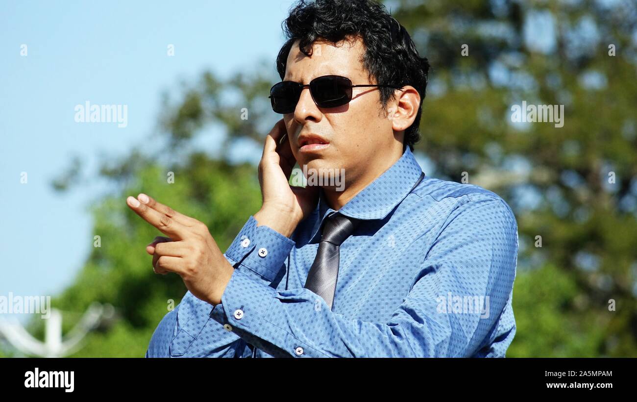 Young Security Guard Pointing Wearing Sunglasses Stock Photo - Alamy