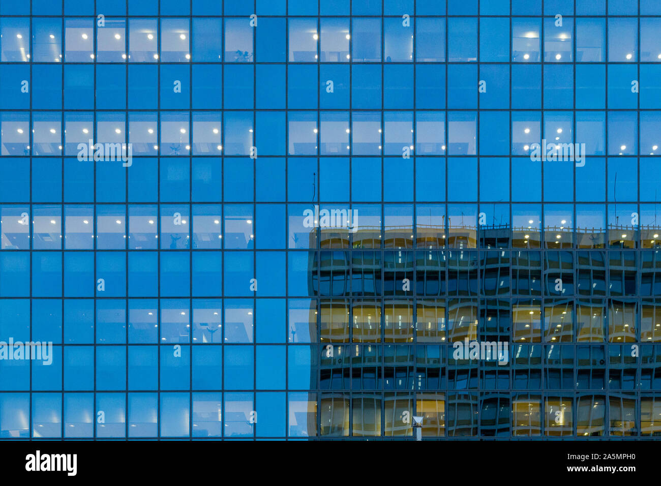 Athens, Greece, reflections on the glass side of a skyscraper, in ...
