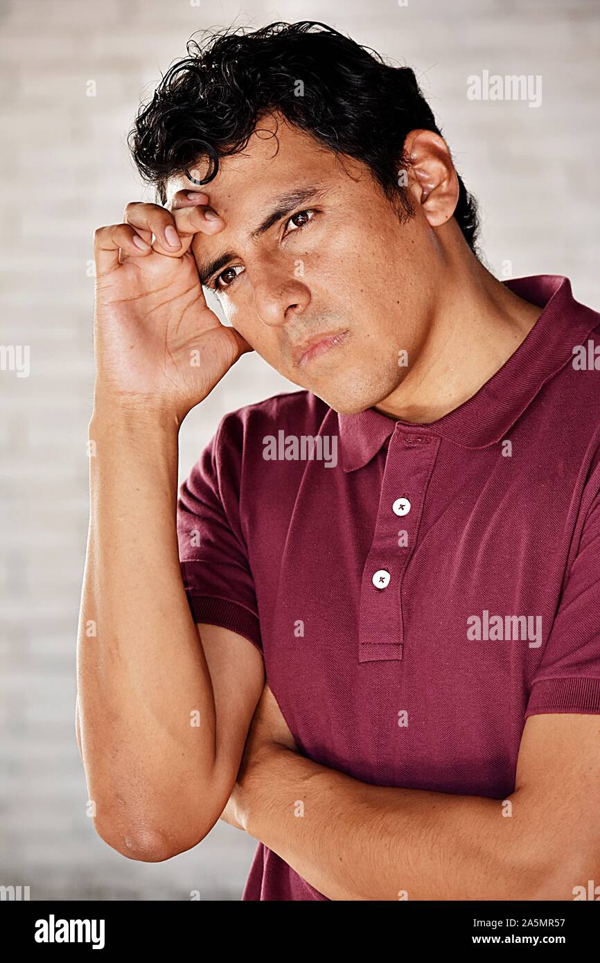 Latino Man Making A Decision Stock Photo - Alamy