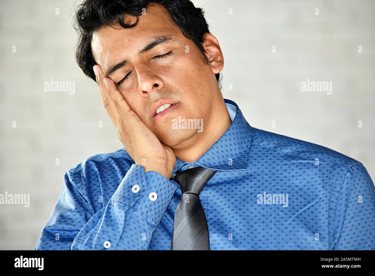 Sleepy Handsome Businessman Stock Photo - Alamy