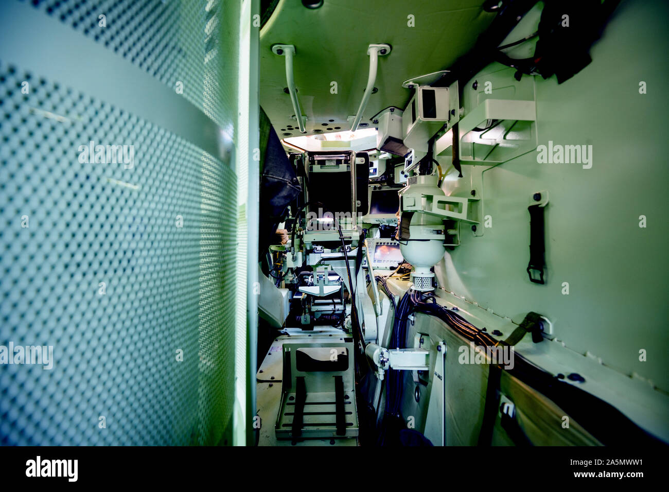 Interior view of empty multi-role armored military vehicle personnel ...