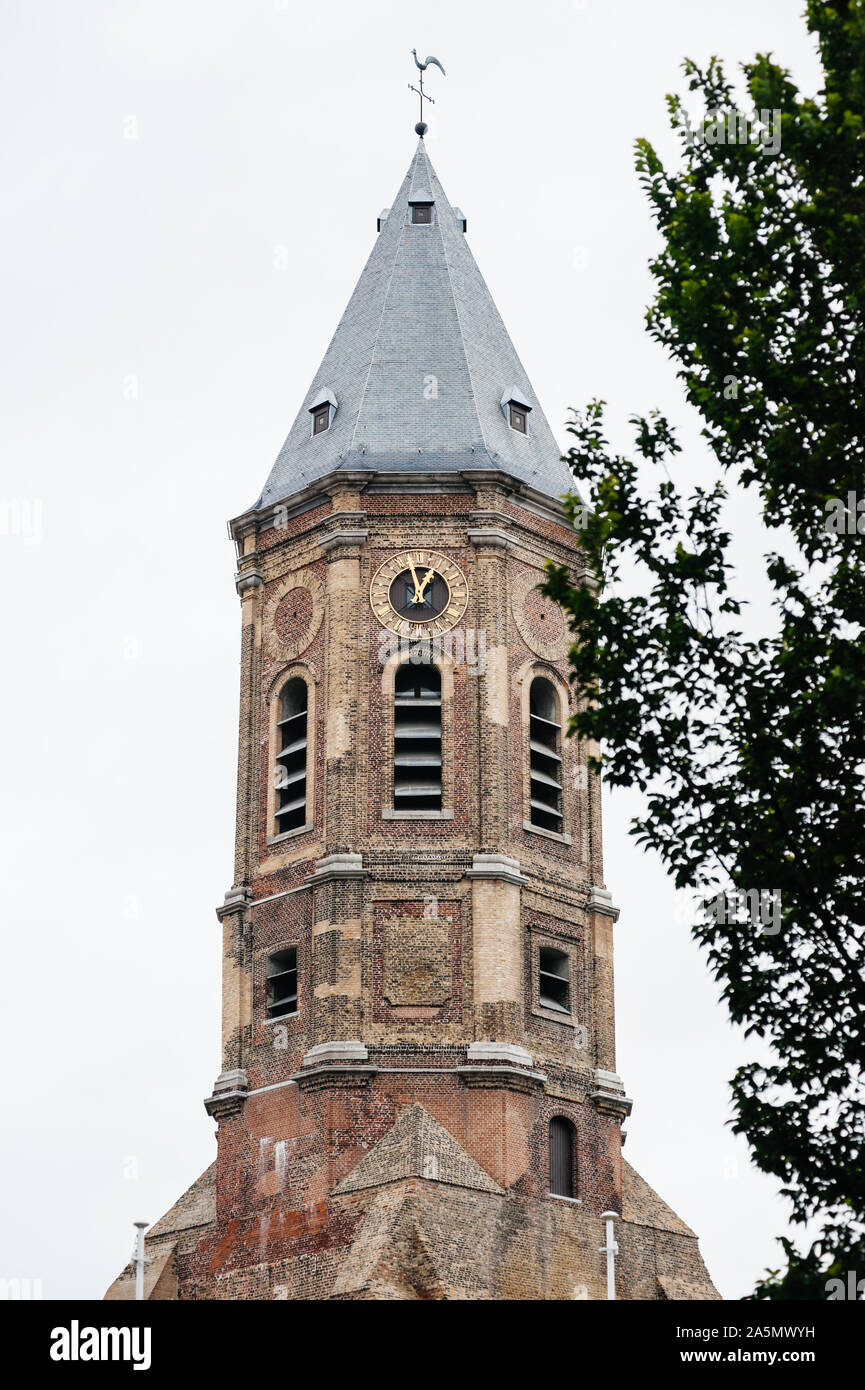 Beautiful Ostend Church tower with golden clock on the facade Stock ...