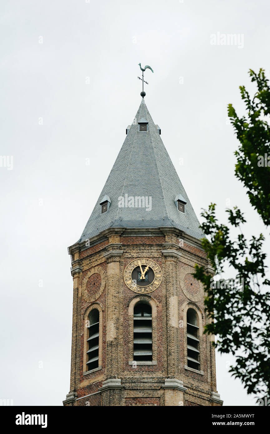 Beautiful ostend Church tower with golden clock on the facade Stock ...