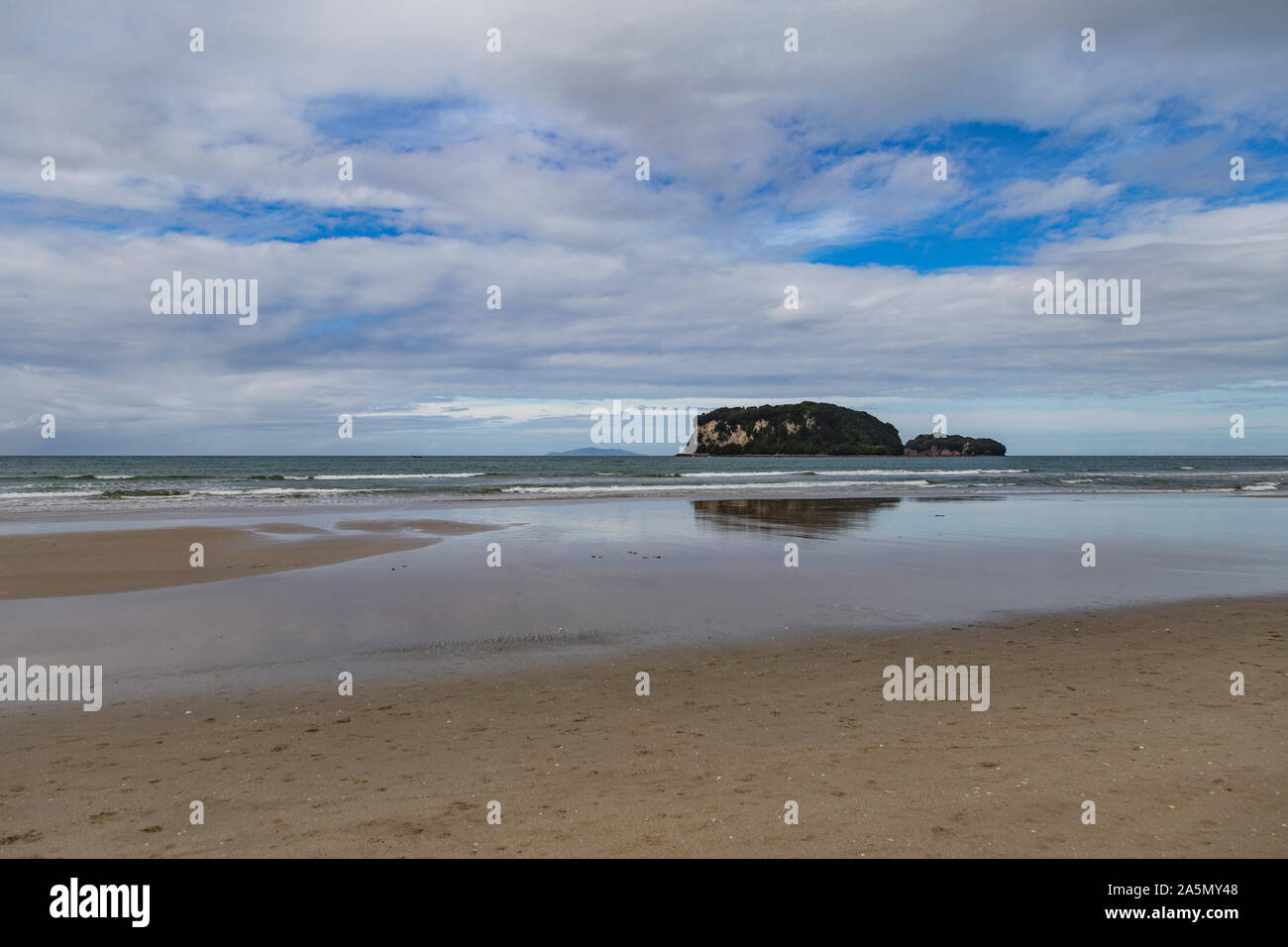Landscape of Whangamata with Whenuakura Island reflecting in low tide ...