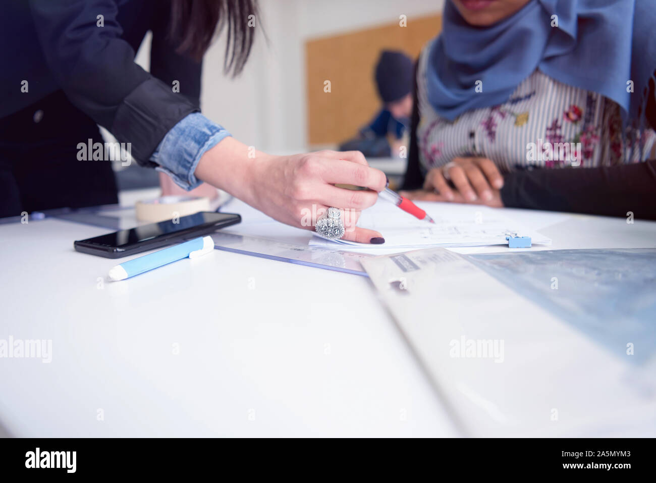 Female Architecture teacher at work. Female professor explain ...
