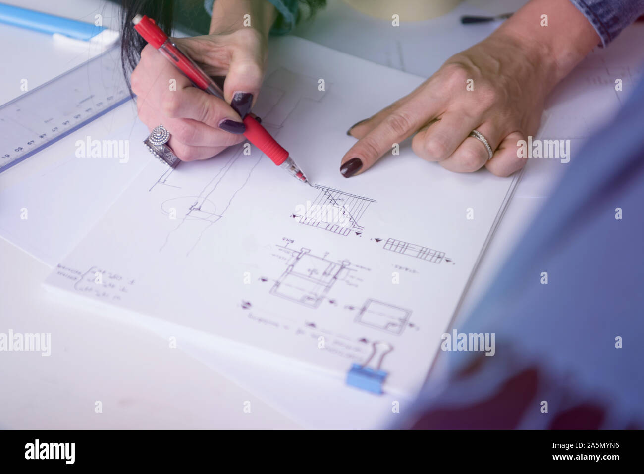 Female Architecture teacher at work. Female professor explain ...