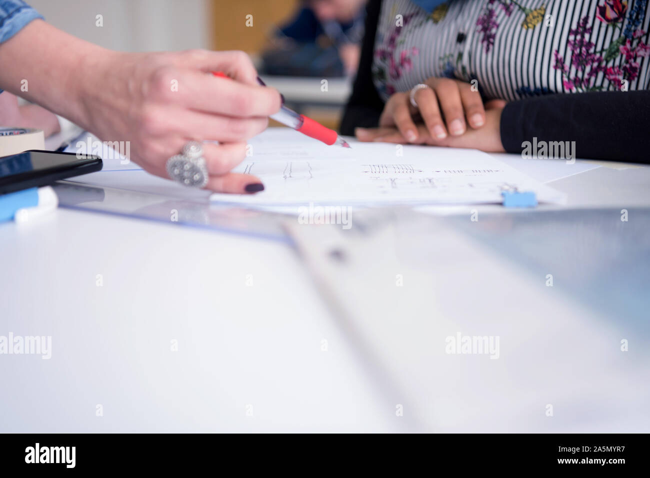 Female Architecture teacher at work. Female professor explain ...